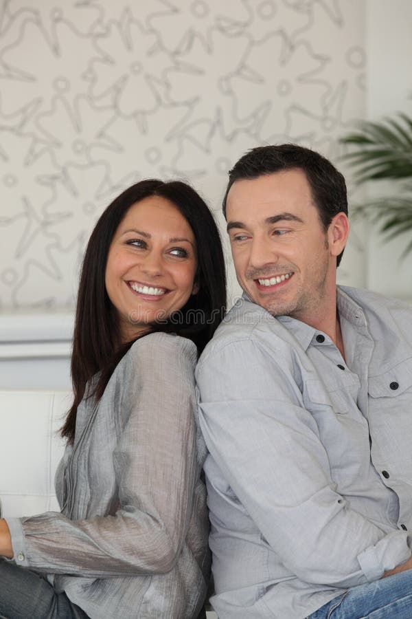 Couple Sitting Back To Back Stock Photo - Image of people, love: 27091158