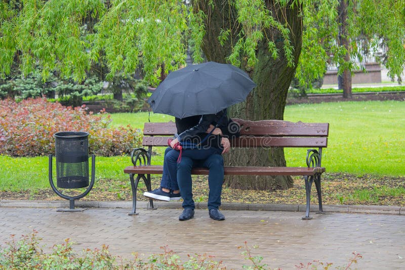 Couple Sitting on Bench in the Rain Stock Photo - Image of park, adult ...