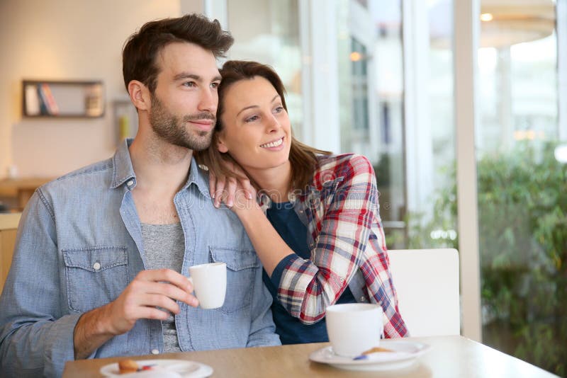 Couple Sitting and Drinking Coffee in Coffee Shop Stock Image - Image ...