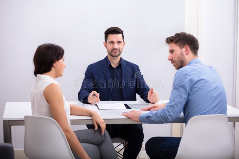 Couple Sitting in Front of Judge Stock Photo - Image of lawyer, indoors ...