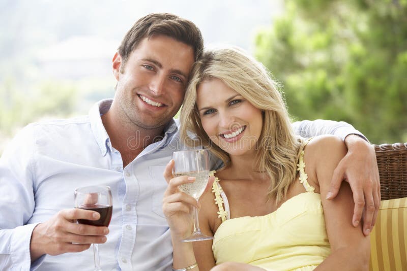 Couple Sitting on Outdoor Seat Together Stock Photo - Image of glass ...