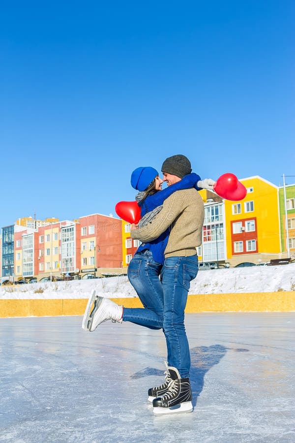 Couple Skating Hugging Balloons in the Shape of Heart Stock Photo ...