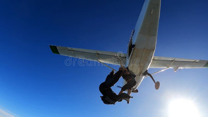 A Couple of Skydivers Jump Out of the Plane Stock Photo - Image of ...