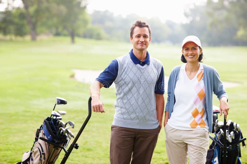 Couple Smiling on Golf Course. Portrait of Couple Standing on Golf ...