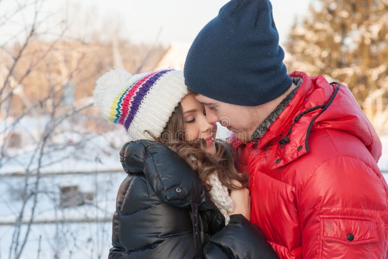 Couple Smiling with Perfect Teeth Hugging and Looking at Camera in ...