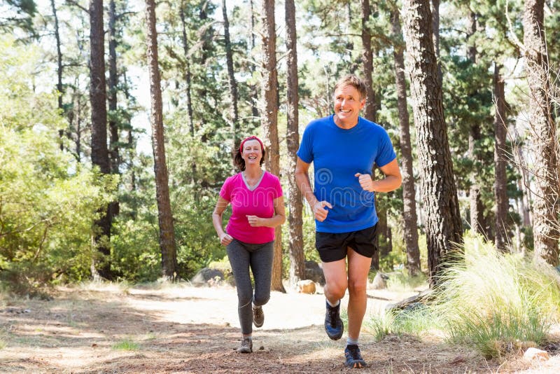 Couple smiling and running stock image. Image of green - 69810461