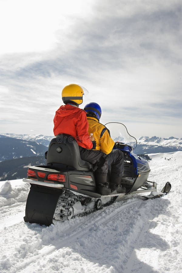 Couple on snowmobile. stock image. Image of male, photograph - 3206313