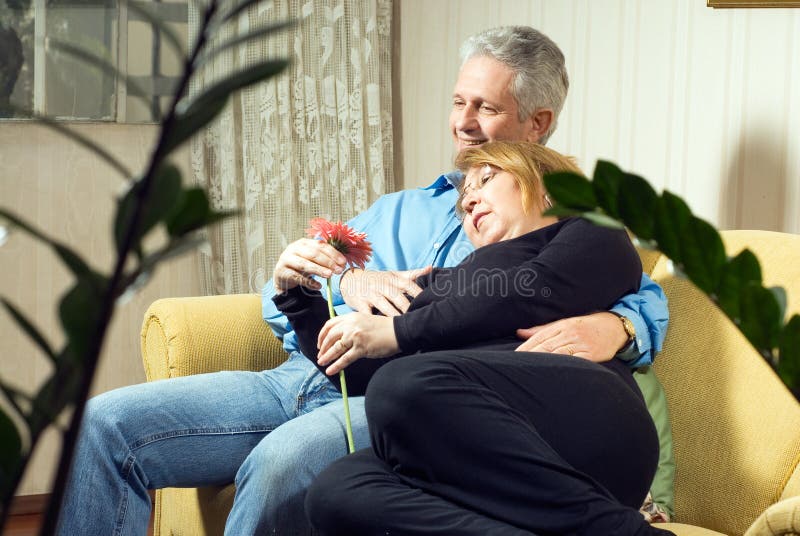 A Couple Snuggling on a Couch Together-Vertical Stock Image - Image of ...