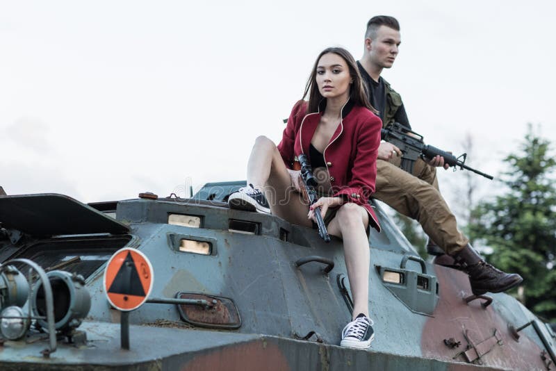 Couple of Soldiers Sitting on the Tank. Stock Photo - Image of jacket ...
