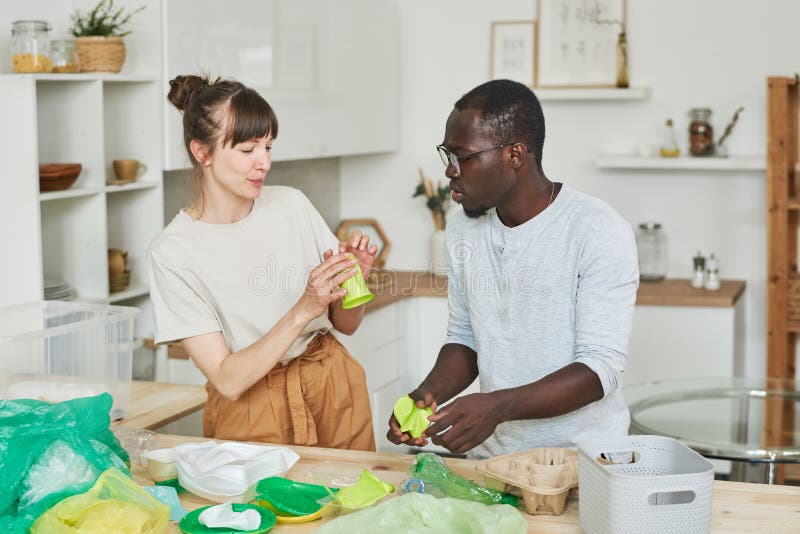Couple sorting the rubbish stock image. Image of working - 221376079
