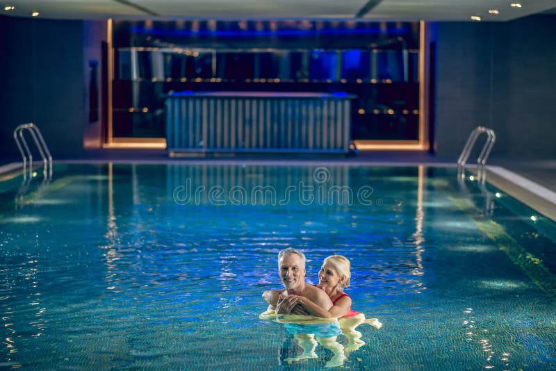 Couple Spending Time in a Swimming Pool and Looking Romantic Stock ...