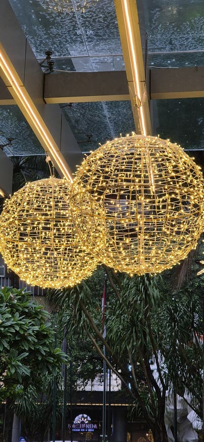 A Couple of Spherical Led Lamp with Yellow Light Hanging on Ceiling ...