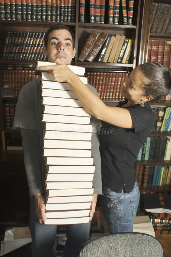 Couple Stacking Books - Vertical Stock Image - Image of files, hispanic ...