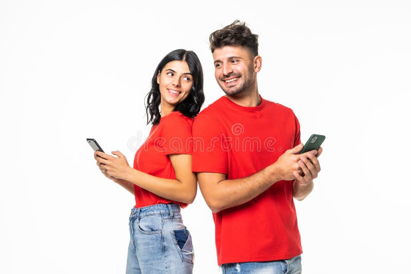 Young Couple Standing Back To Back and Using Smartphone Isolated on ...