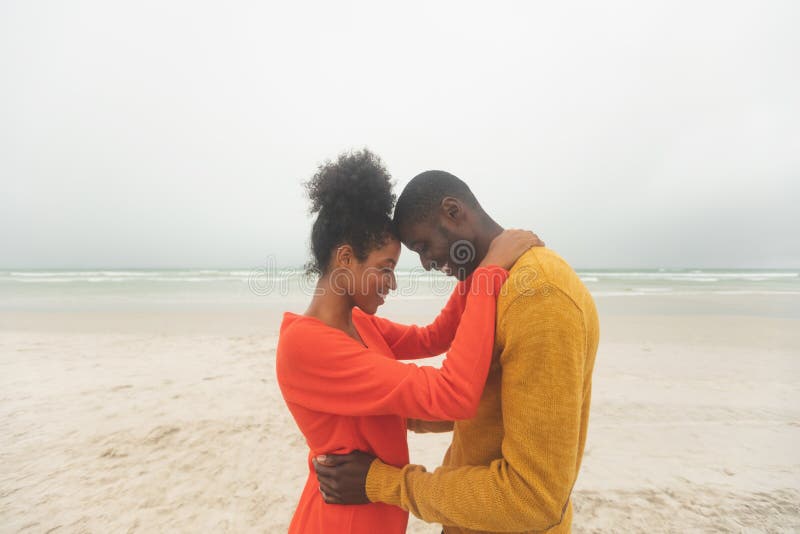Couple Standing at Beach on a Sunny Day Stock Photo - Image of ...