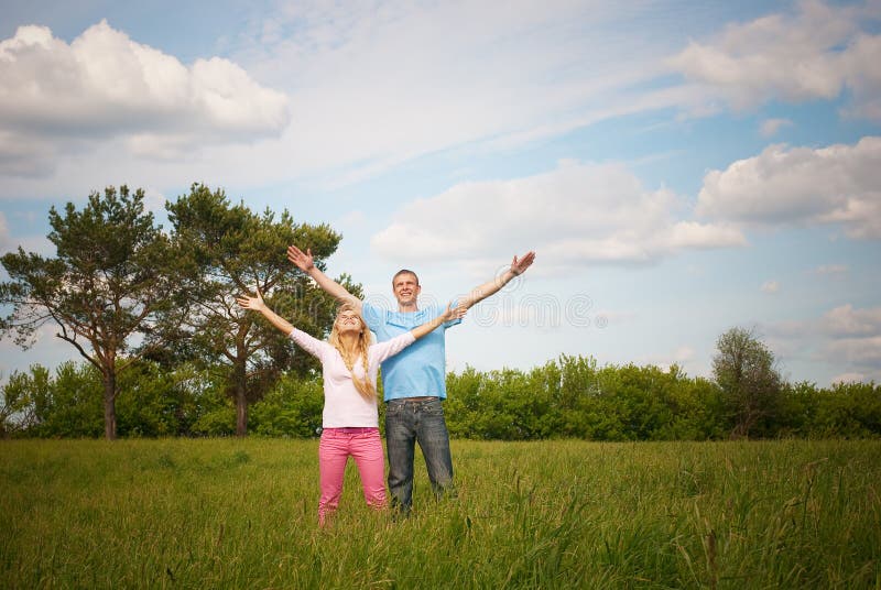 Couple standing on grass stock image. Image of laughing - 13168641