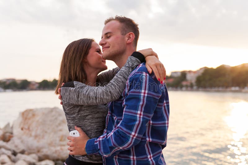 Couple Standing Near Seashore, they are in Love. Stock Image - Image of ...