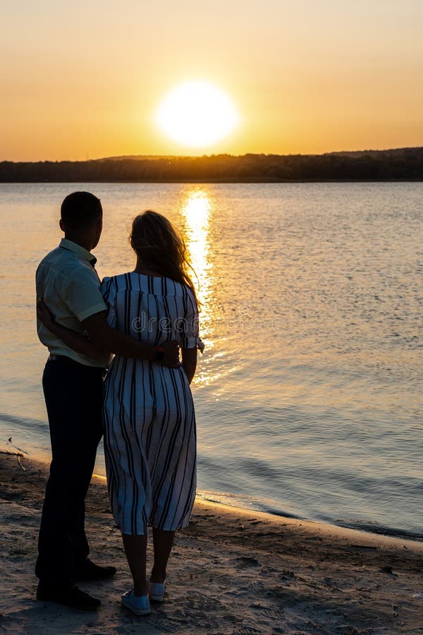 Couple Standing on the Sunset on the Beach Stock Image - Image of ...