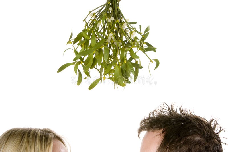 Couple Standing Under Mistletoe Stock Image - Image of studio, couple ...