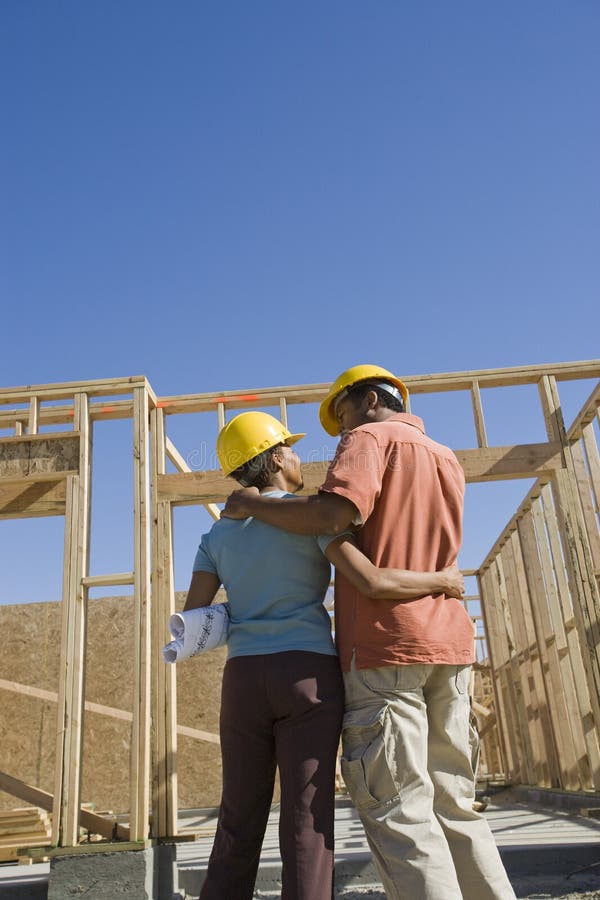 Couple Standing at an Unfinished Housing Construction Stock Image ...