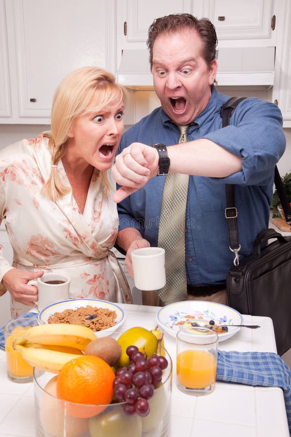 Couple in Kitchen Late for Work Stock Photo - Image of professional ...