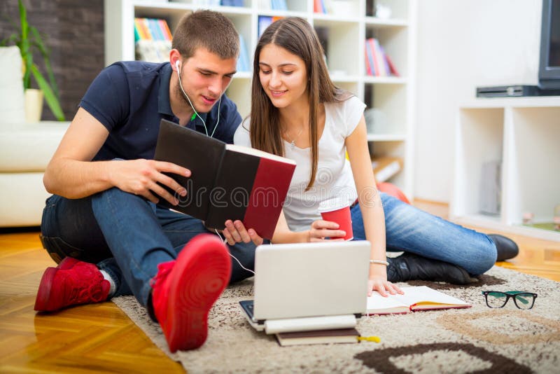 Couple of Students Sitting on the Floor at Home and Preparing for the ...