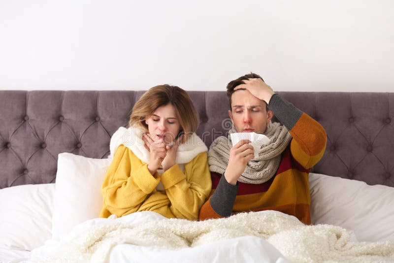 Couple Suffering from Colds in Bed Stock Photo - Image of person ...