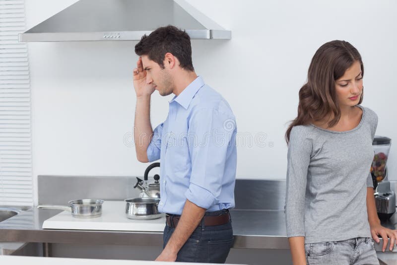 Couple Sulking at Each Other in the Kitchen Stock Image - Image of ...