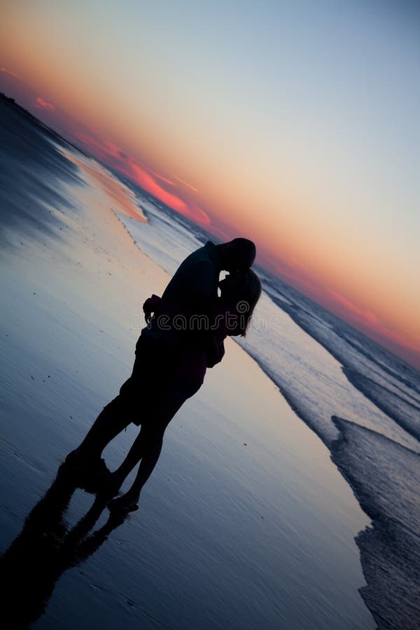Couple on sunrise stock image. Image of sunset, shore - 15112455