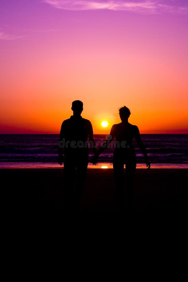 Couple in sunset stock photo. Image of coast, water, beach - 13476296