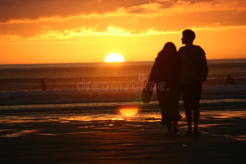 Couple @ sunset stock image. Image of beach, clouds, silhouette - 998525