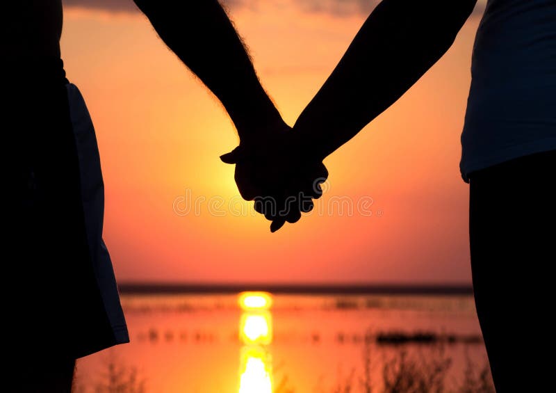 Couple at Sunset Holding Hands Stock Photo - Image of hold, silhouette ...