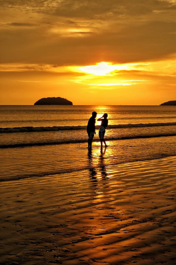 Couple in sunset stock image. Image of holiday, sunset - 97771457