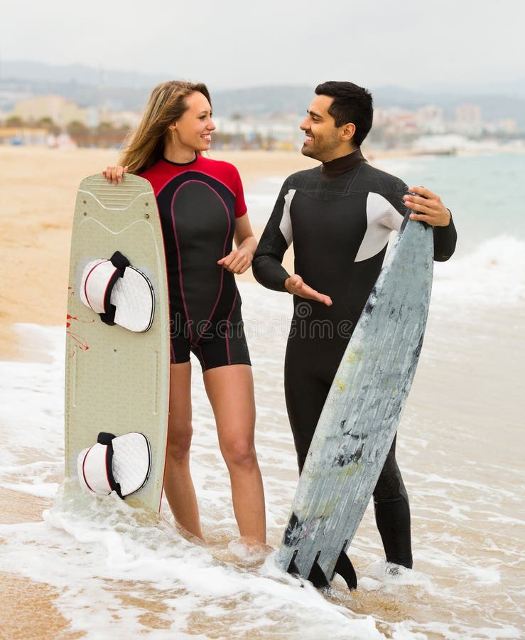 Couple in surf in beach stock photo. Image of relationship - 6231452