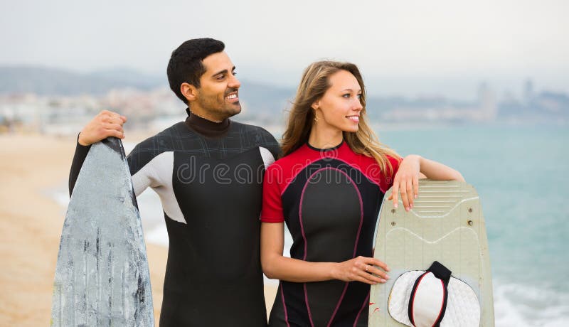 Couple with Surf Boards on the Beach Stock Photo - Image of shore ...