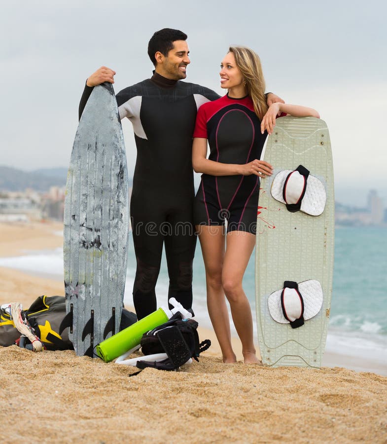 Couple with Surf Boards on the Beach Stock Image - Image of close ...