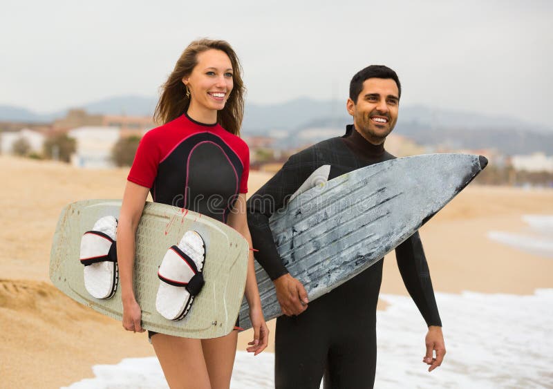 Couple in surf in beach stock photo. Image of relationship - 6231452