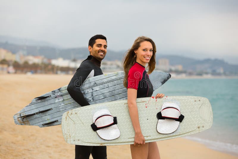 Couple in surf in beach stock photo. Image of relationship - 6231452
