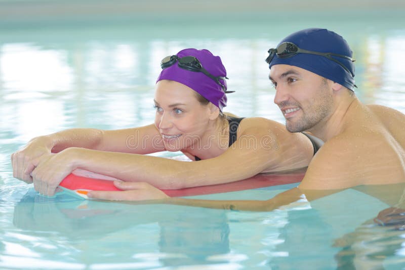 Couple swimming in pool stock photo. Image of couple - 102287680