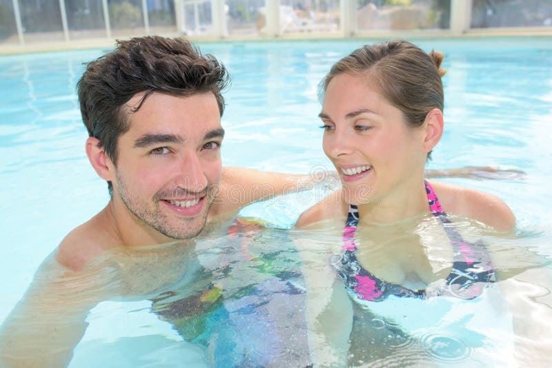 Couple in swimming pool stock image. Image of couple - 117900579