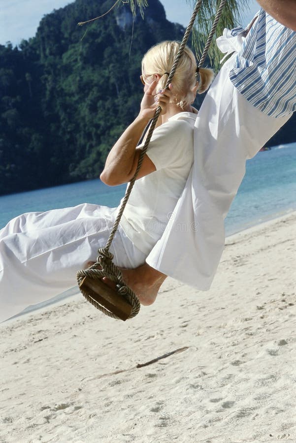 Swing on the beach stock image. Image of wood, spring, round - 127887