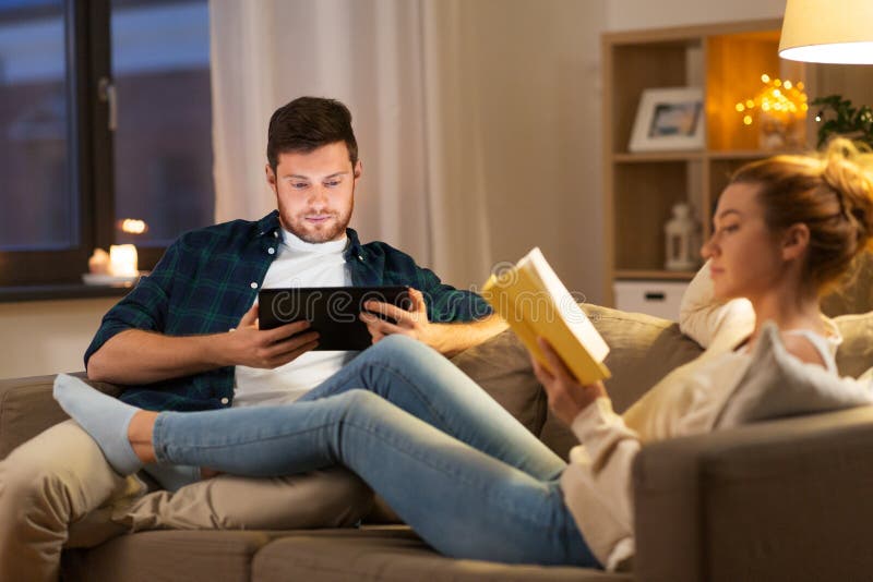 Couple with Tablet Computer and Book at Home Stock Image - Image of ...