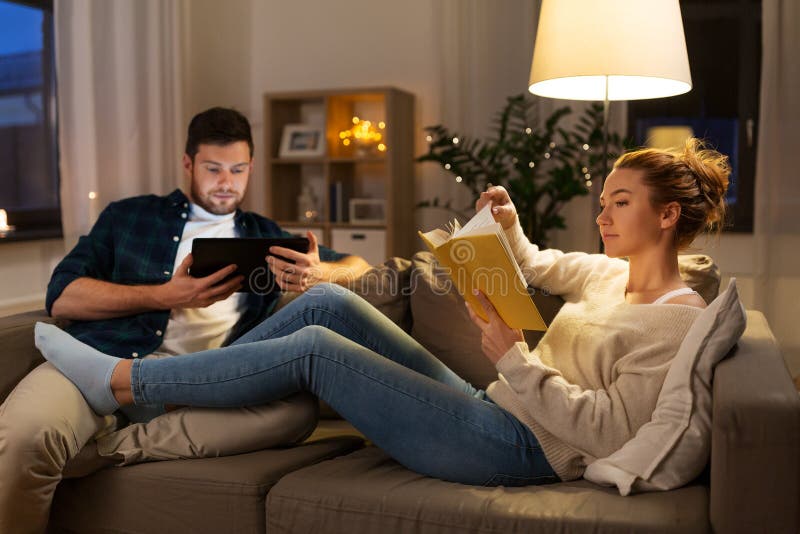 Couple with Tablet Computer and Book at Home Stock Image - Image of ...