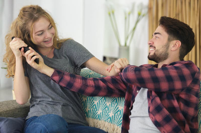 Couple Tagging Over Remote Control Stock Image - Image of modern, view ...