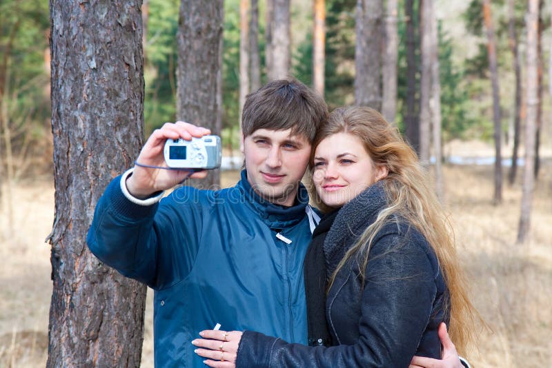 Couple with video camera. stock image. Image of outdoors - 2431845