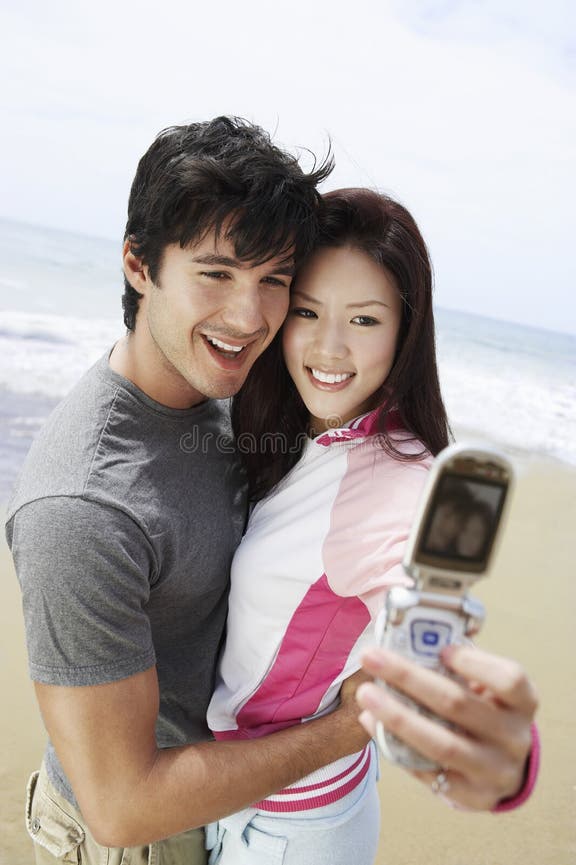 Couple Taking Self-Portrait through Cell Phone Stock Image - Image of ...