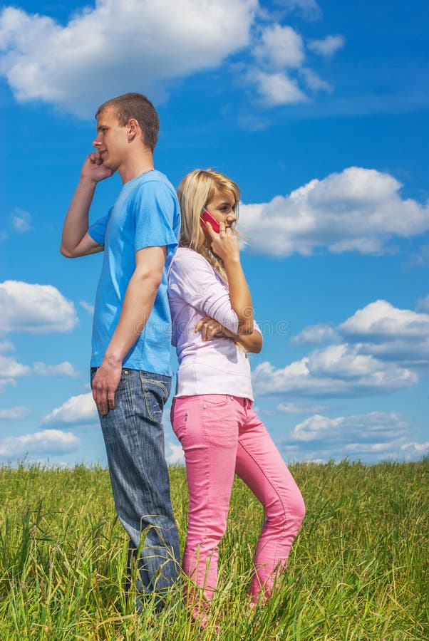 Couple talk on cell phones stock photo. Image of connection - 65880114