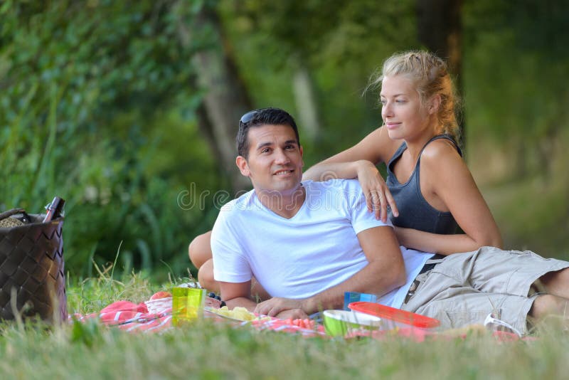 Couple Talking while Having Rest in Park Stock Image - Image of ...