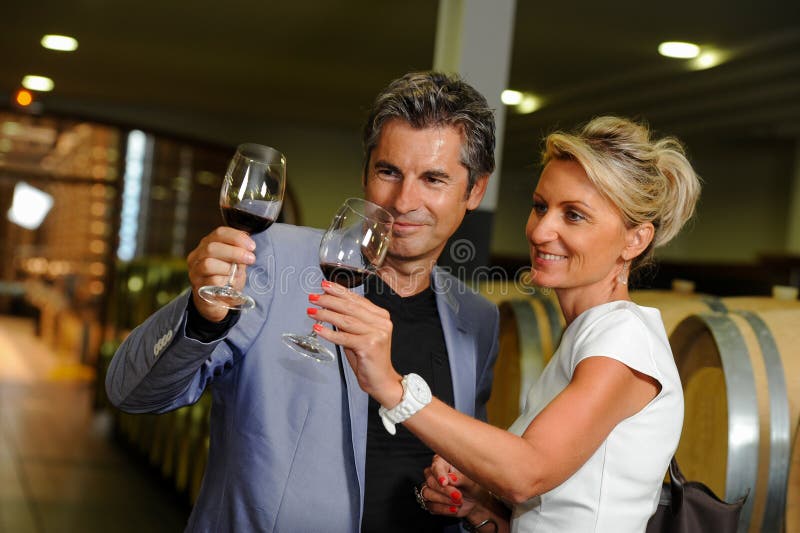 Couple Tasting Wine in a Cellar Stock Photo - Image of drink, cellar ...