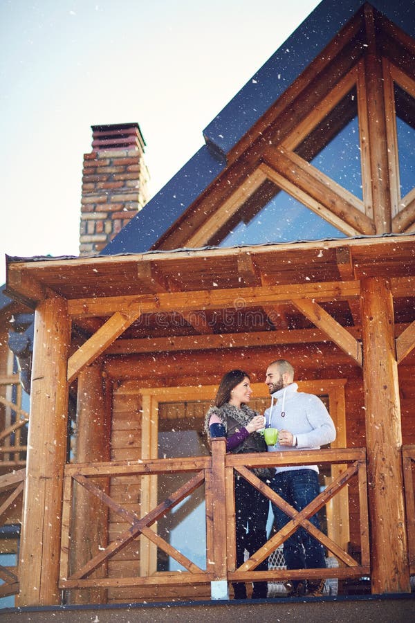 Couple on terrace of house stock photo. Image of caucasian - 81966772
